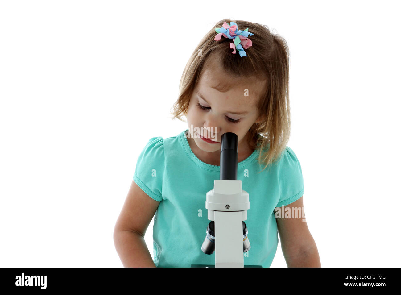 Toddler looking through a microscope on white background Stock Photo ...