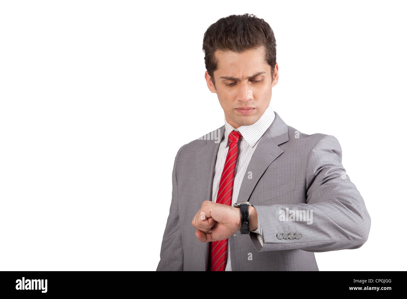 Businessman checking the time Stock Photo - Alamy