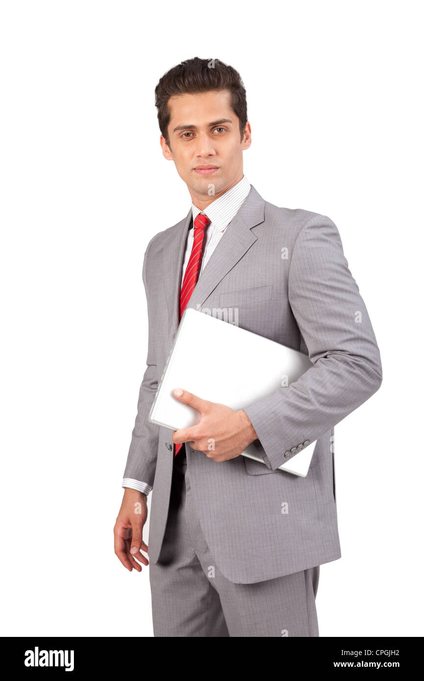 Businessman holding laptop Stock Photo - Alamy Businessman holding laptop Stock Photo - Alamy