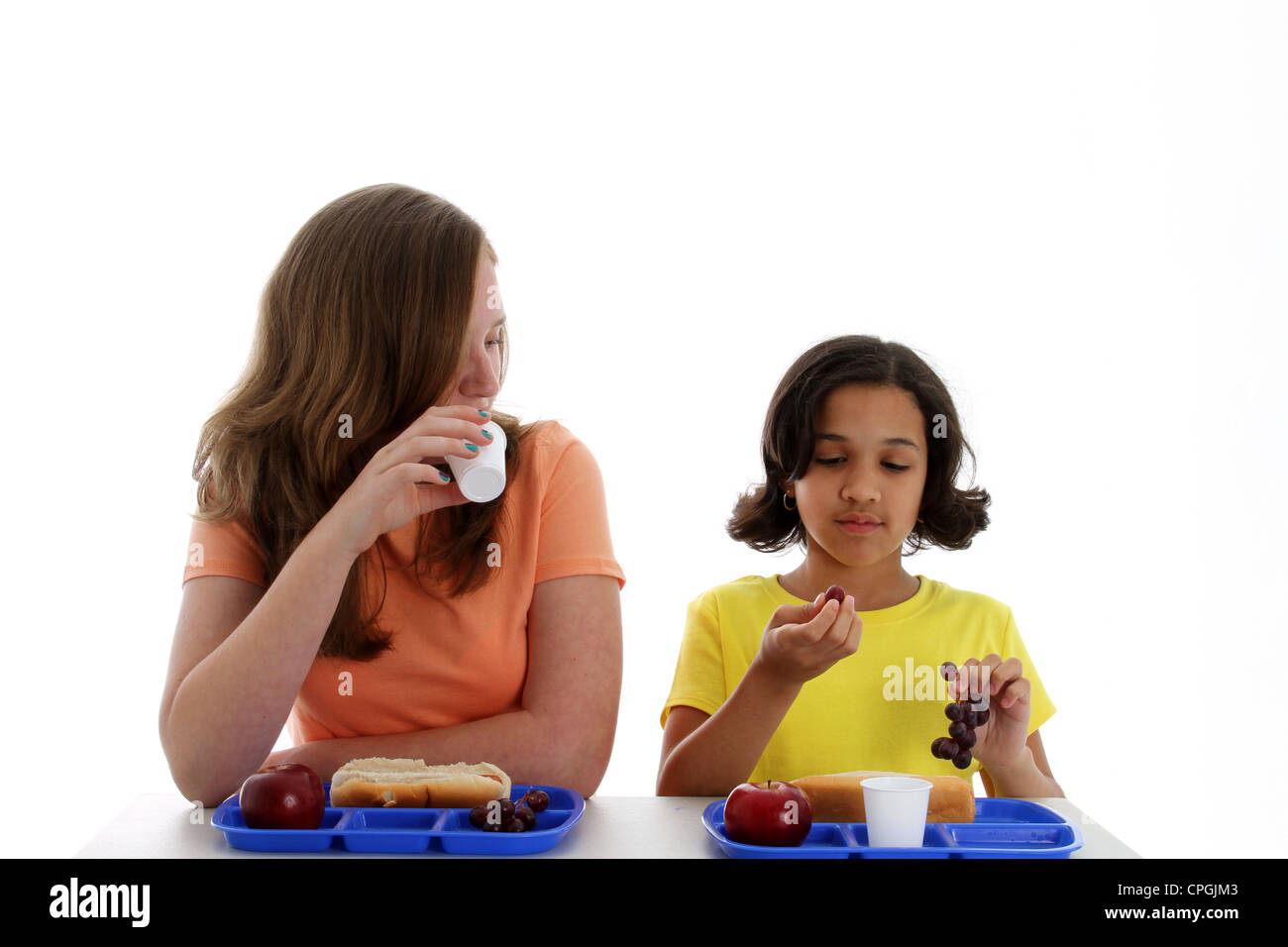 Kids eating their lunch together at school Stock Photo - Alamy