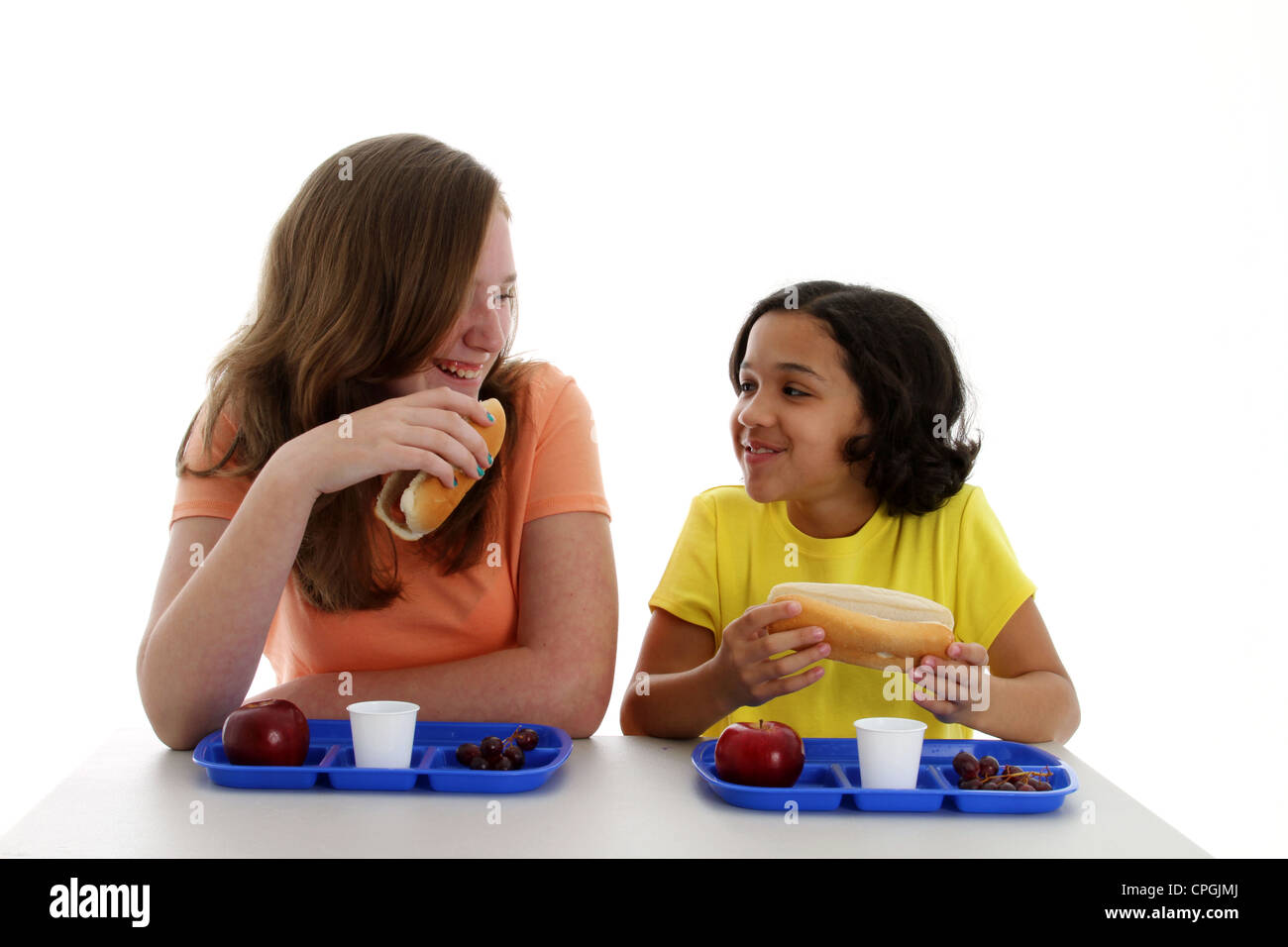 Kids eating their lunch together at school Stock Photo - Alamy