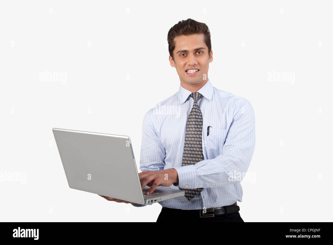 Businessman holding laptop Stock Photo - Alamy
