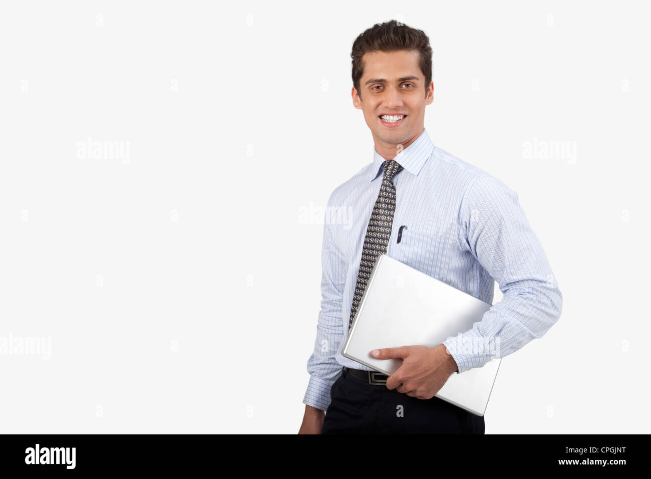Businessman holding laptop Stock Photo - Alamy