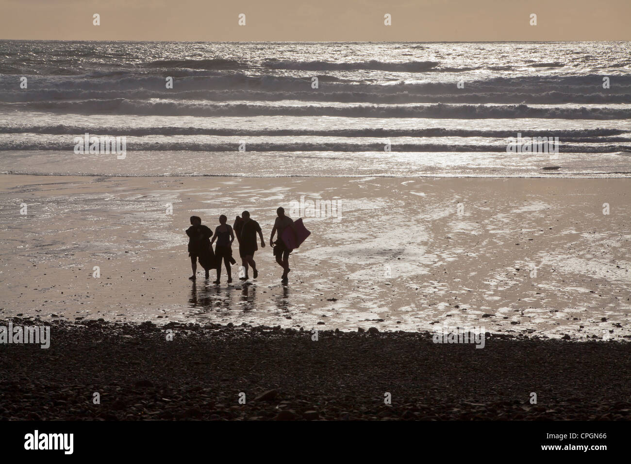 Surfers on beach silhouette hi-res stock photography and images - Alamy