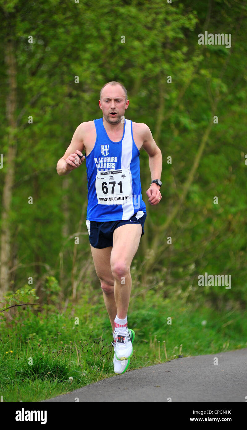 Male runner competing in a road race Stock Photo - Alamy