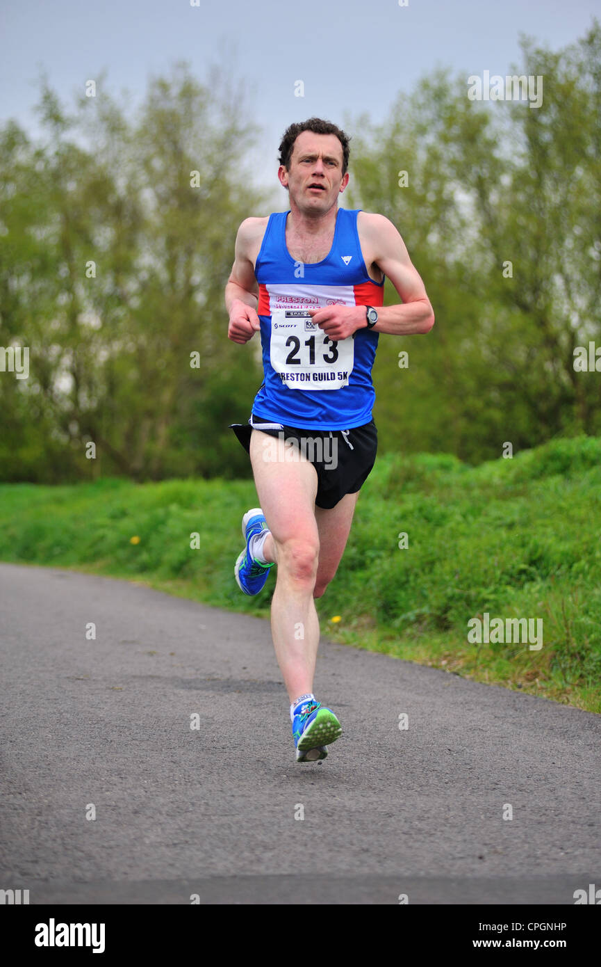 Male runner competing in a road race Stock Photo - Alamy