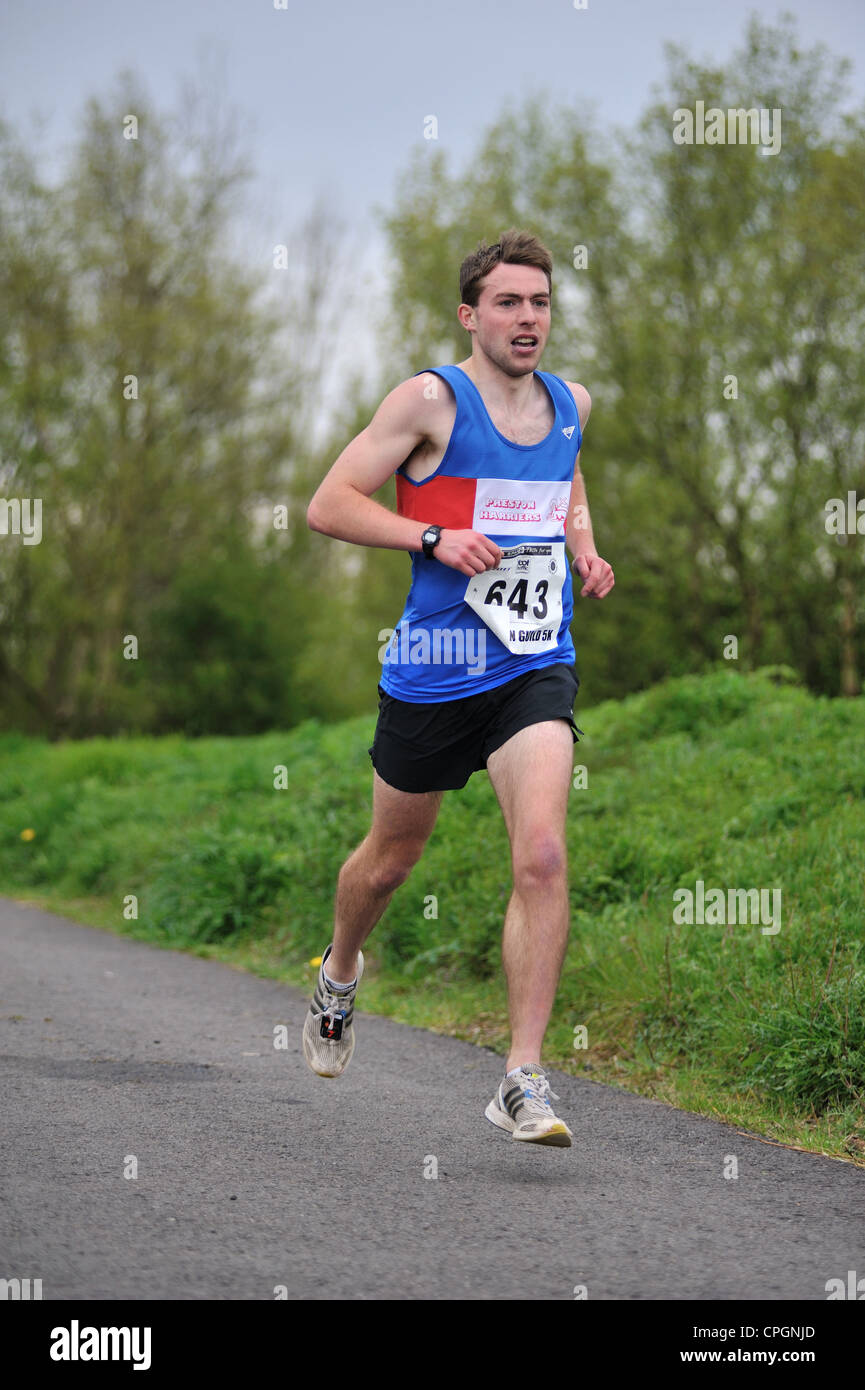 runner running in a road race Stock Photo - Alamy