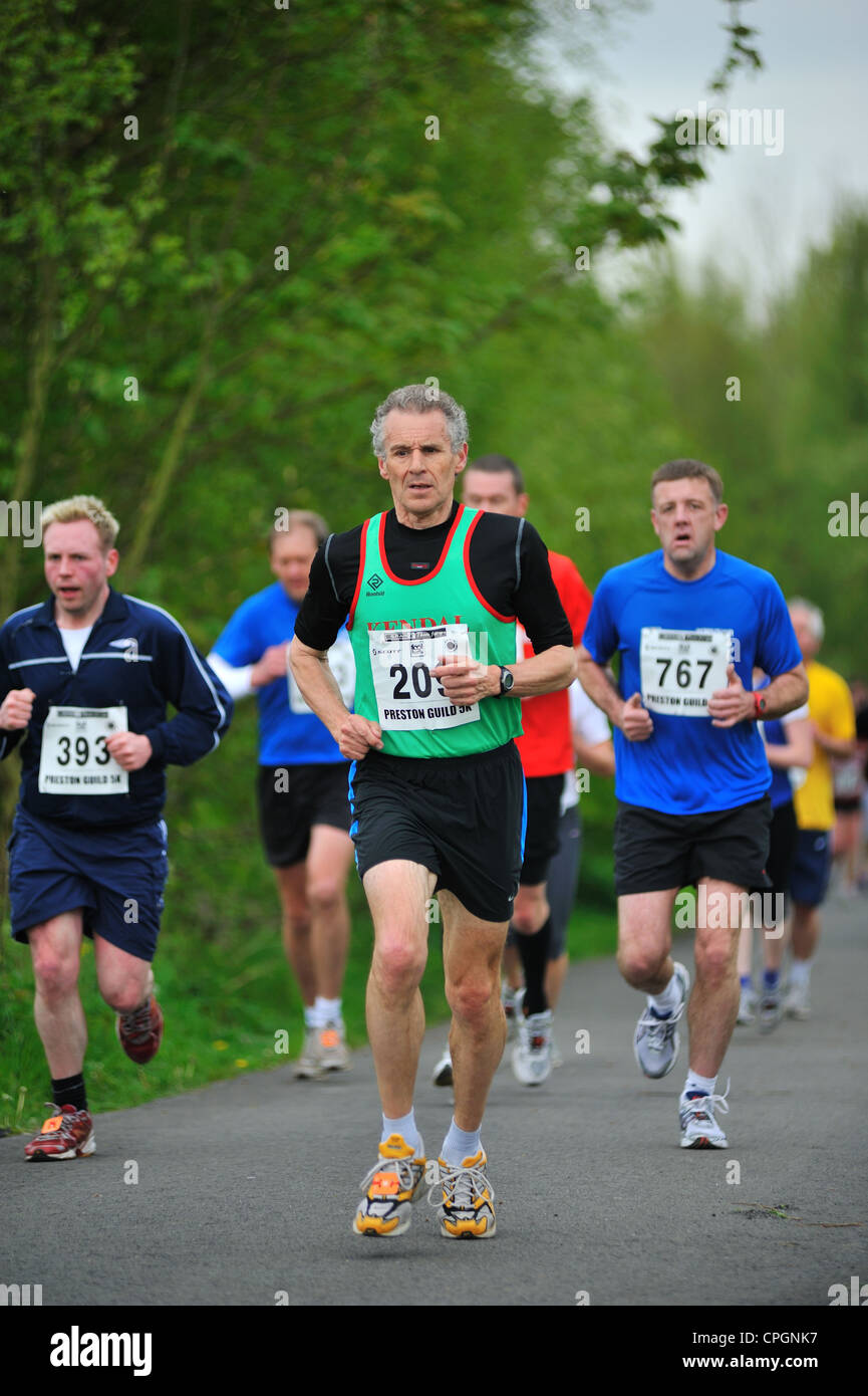 Runners in a road race Stock Photo - Alamy