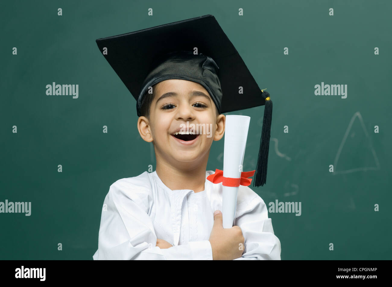 Boy kindergarten graduation mortarboard hi-res stock photography and ...