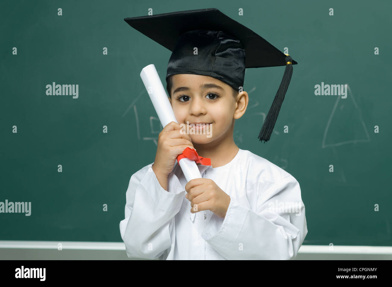Boy kindergarten graduation mortarboard hi-res stock photography and ...