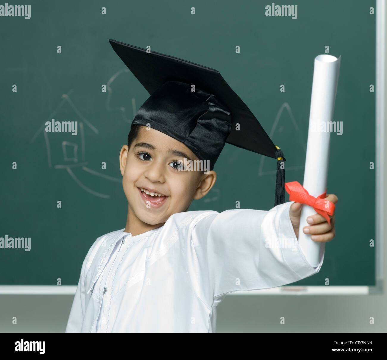 Boy kindergarten graduation mortarboard hi-res stock photography and ...