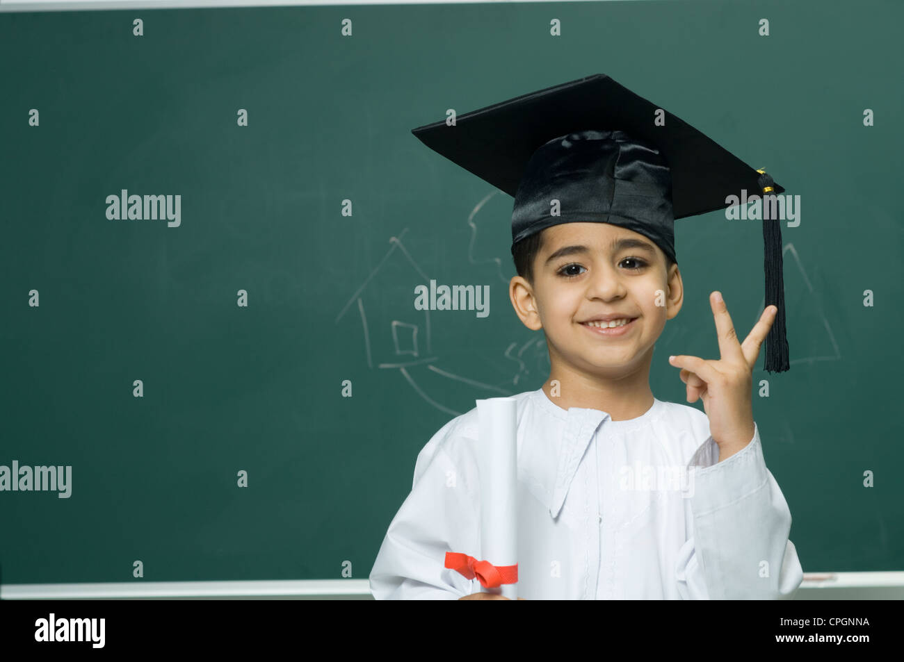 Boy kindergarten graduation mortarboard hi-res stock photography and ...