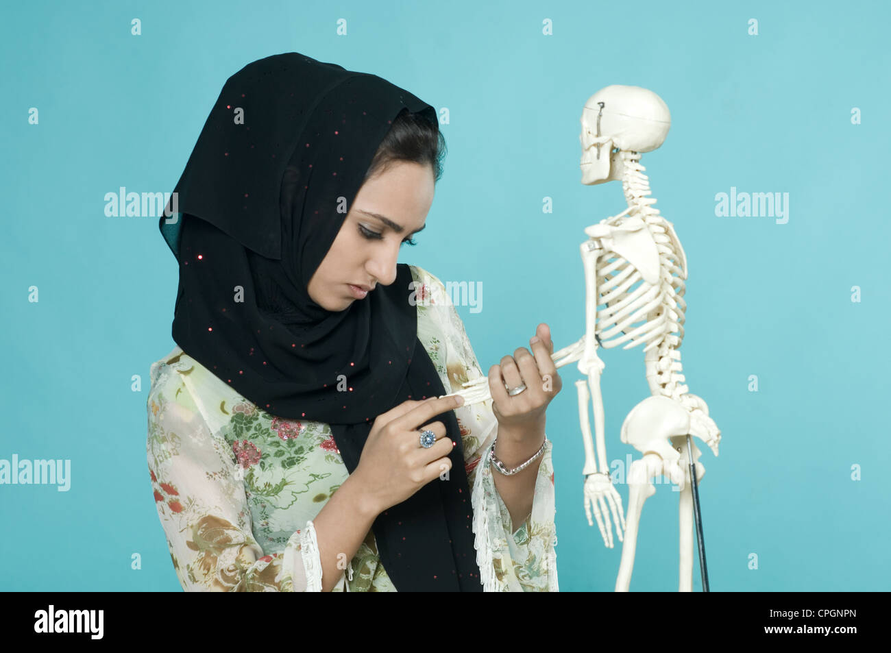 Woman holding human skeleton, close-up Stock Photo - Alamy