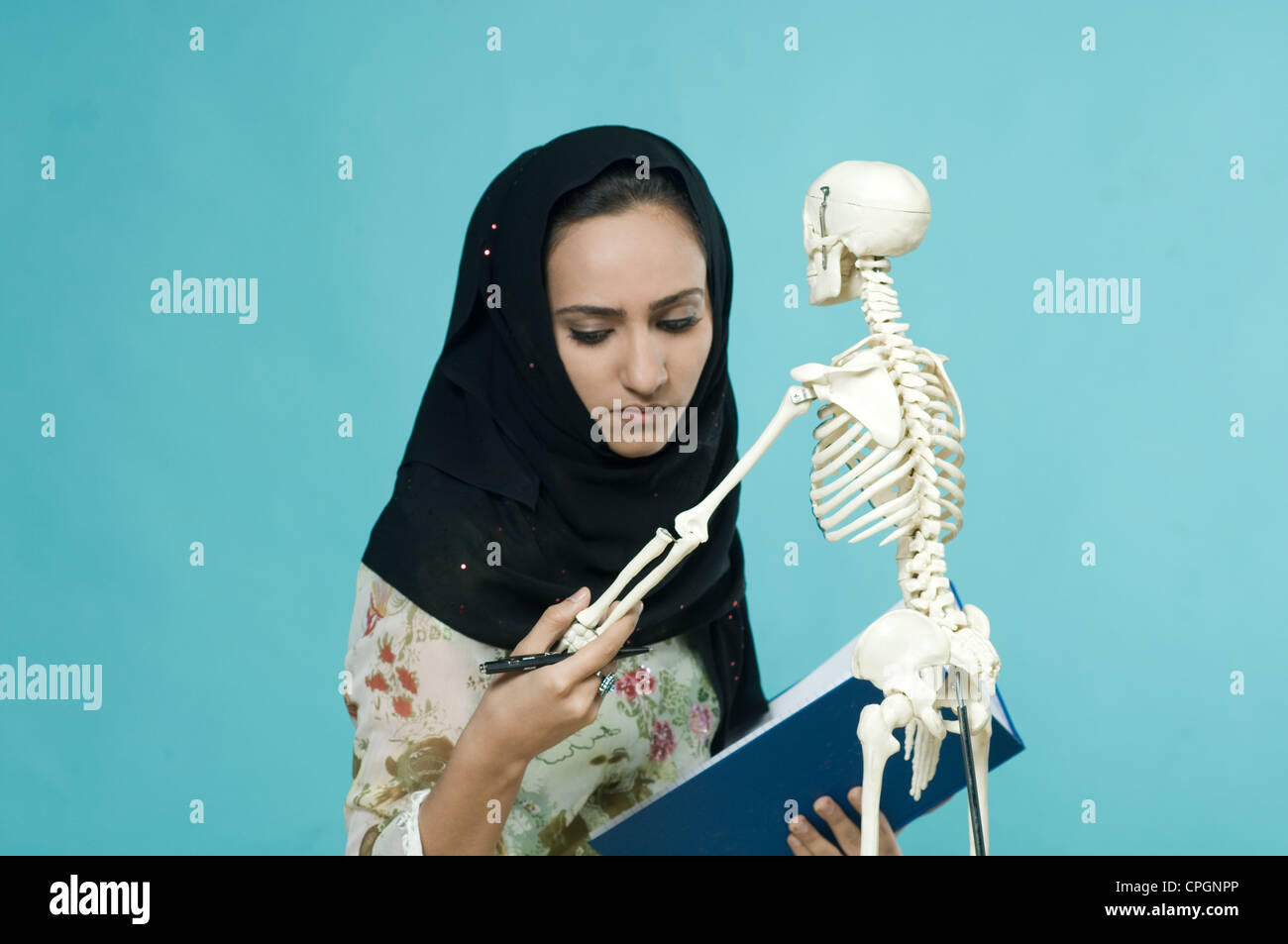 Woman holding human skeleton, close-up Stock Photo - Alamy
