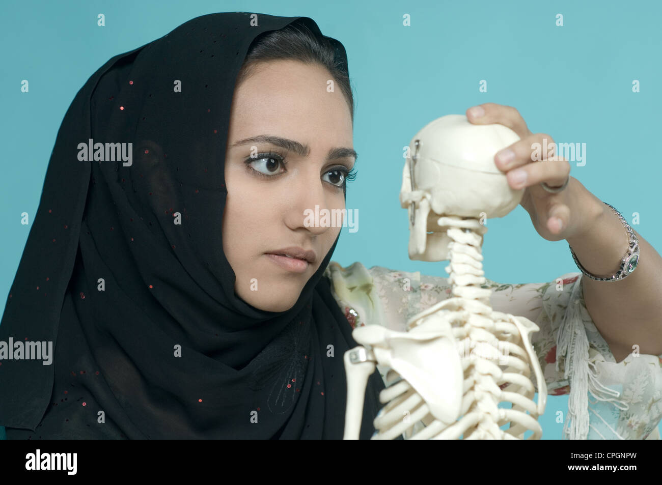 Woman holding human skeleton, close-up Stock Photo - Alamy