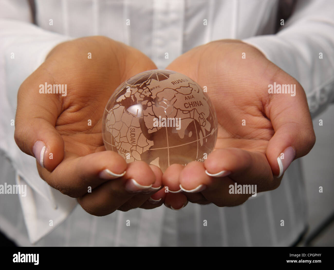 Human hand holding globe, close-up Stock Photo - Alamy
