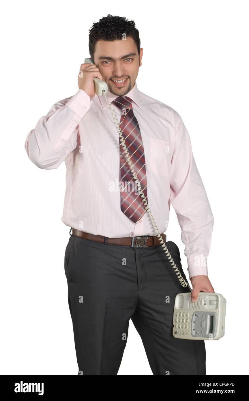 Young man talking on landline phone, portrait Stock Photo - Alamy