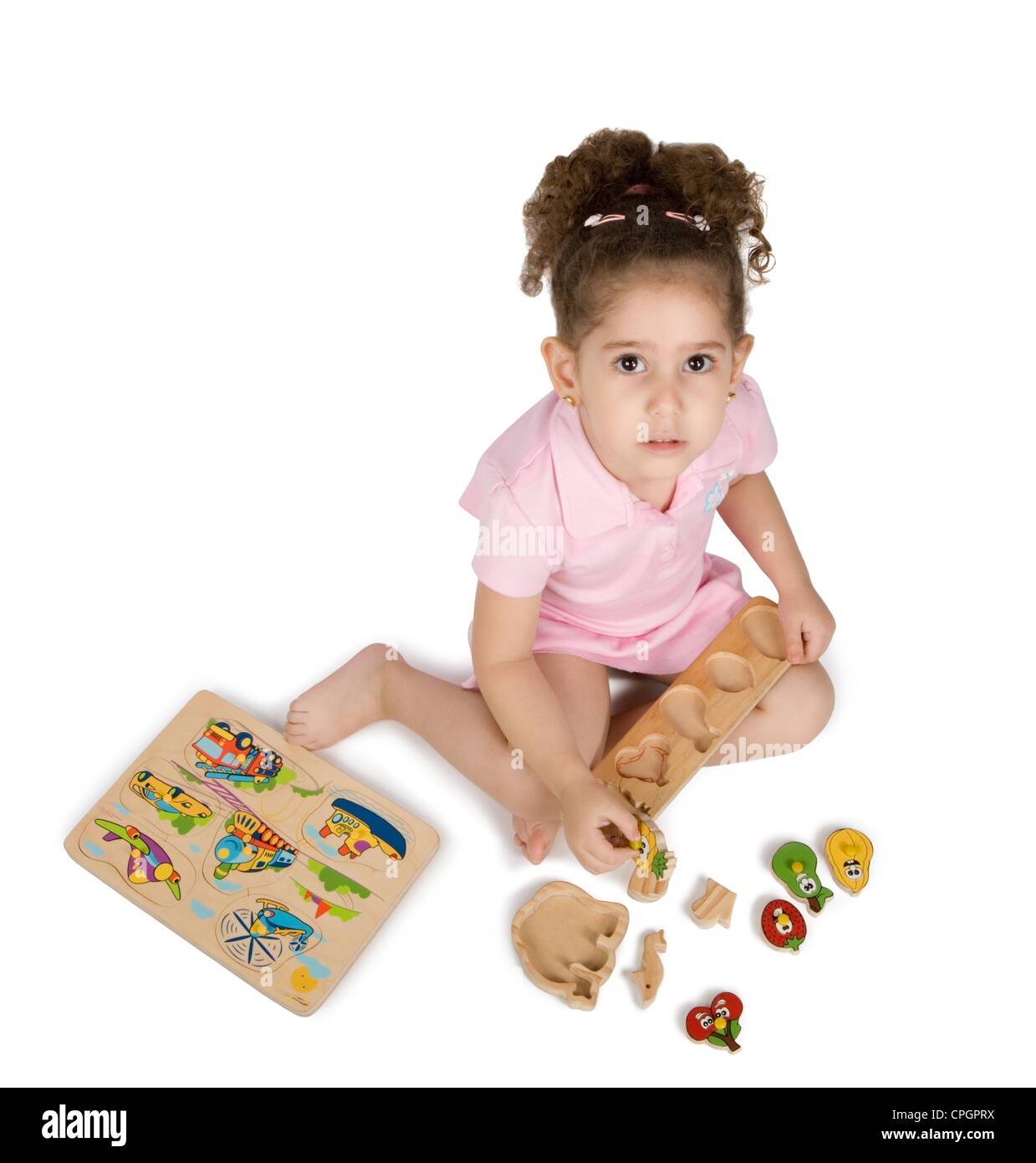 Girl playing with puzzle, portrait Stock Photo - Alamy