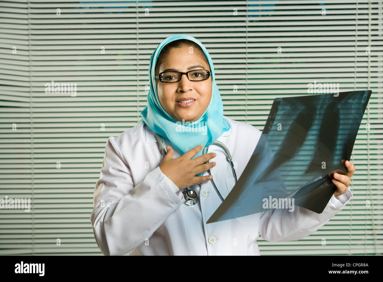 Female doctor holding X-ray, portrait Stock Photo - Alamy