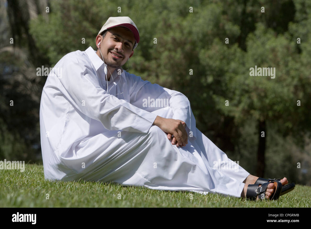 Arab man sitting on park hi-res stock photography and images - Alamy