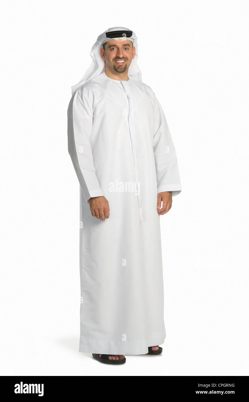 Mid adult man standing against white background, smiling, portrait ...