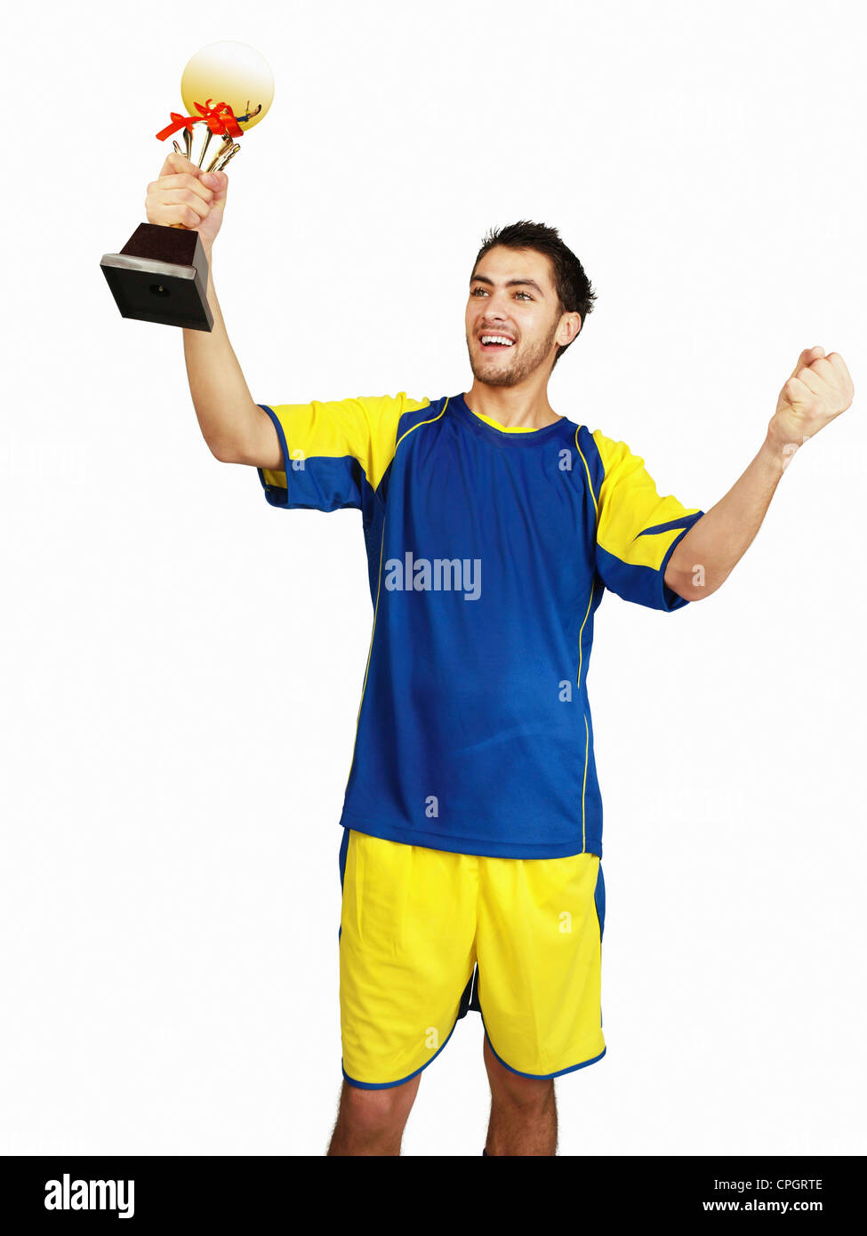 Young man holding trophy, smiling Stock Photo - Alamy