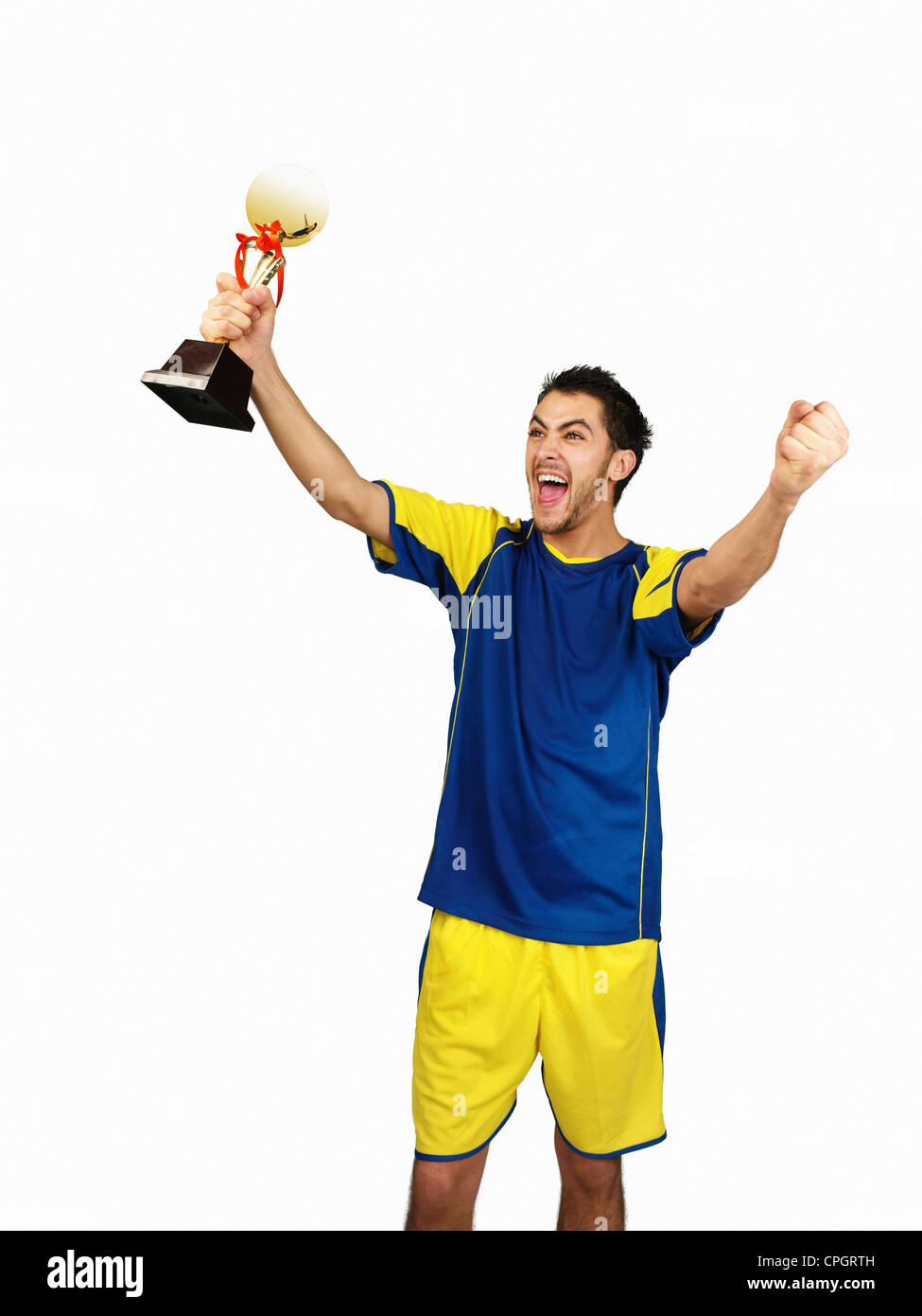 Young man holding trophy, smiling Stock Photo - Alamy