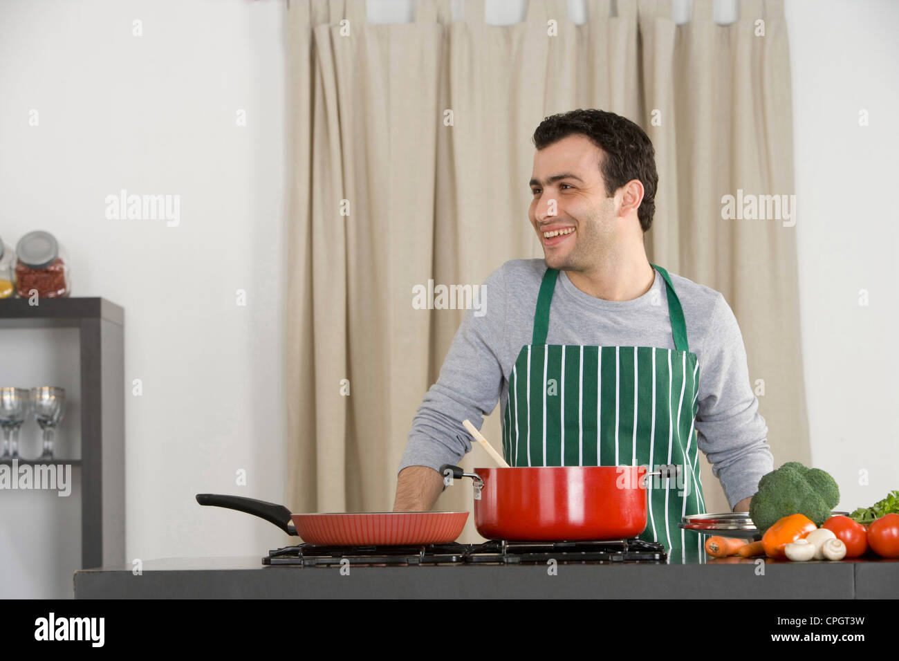 Man cooking at the kitchen Stock Photo - Alamy
