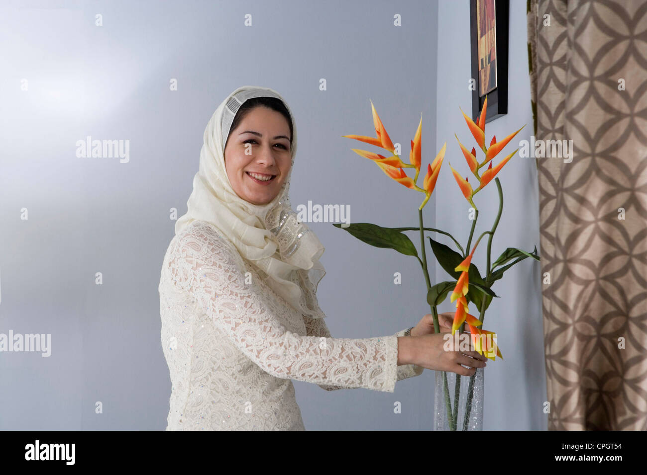 Woman with flowers, foliage, interior hi-res stock photography and ...
