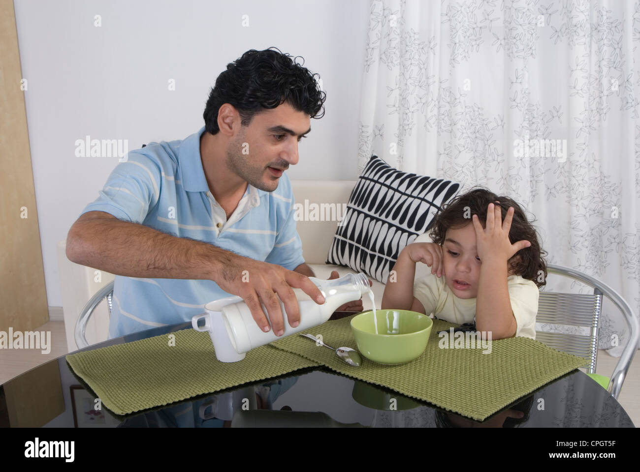 Father and son eating breakfast Stock Photo - Alamy