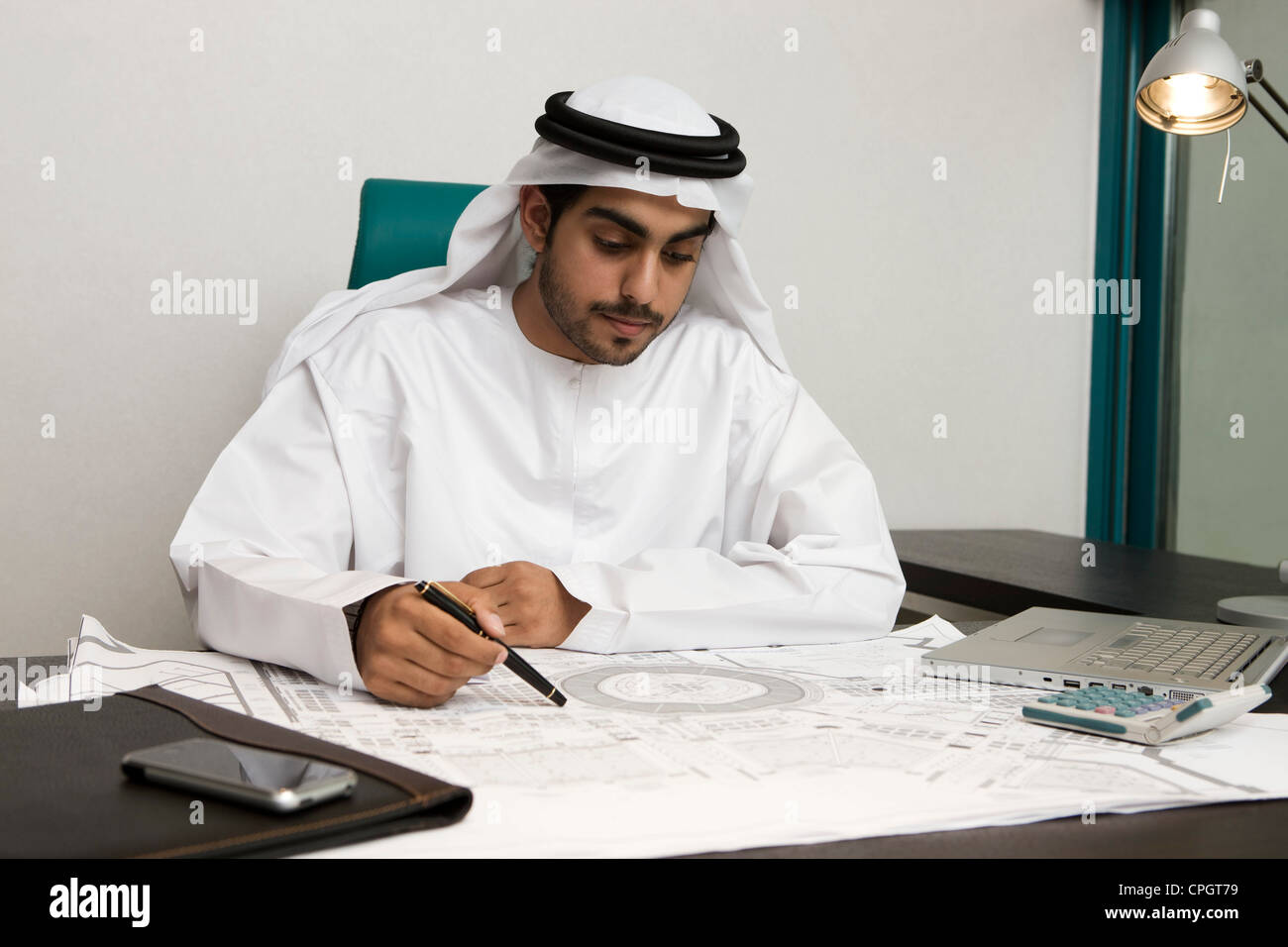 Arab man holding pen hi-res stock photography and images - Alamy