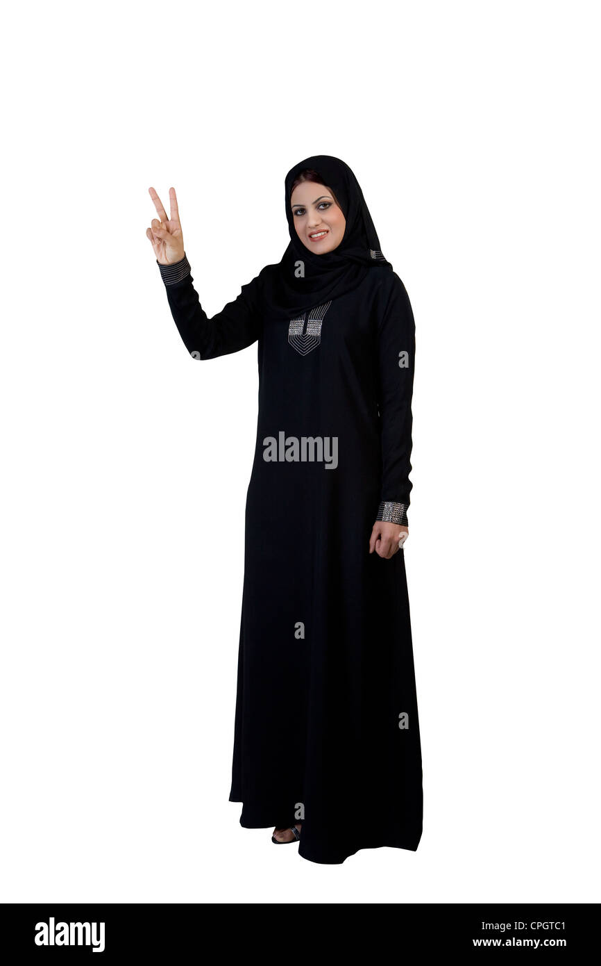 Arab woman giving a peace sign Stock Photo - Alamy
