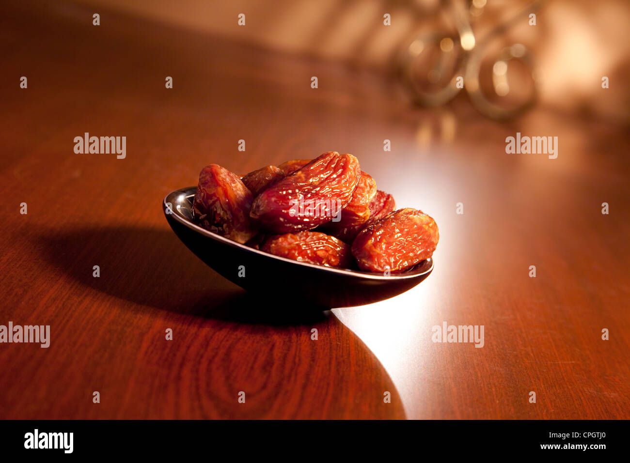 A small plate of dates Stock Photo - Alamy