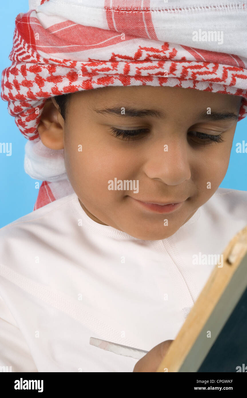 Emirati boy writing hi-res stock photography and images - Alamy