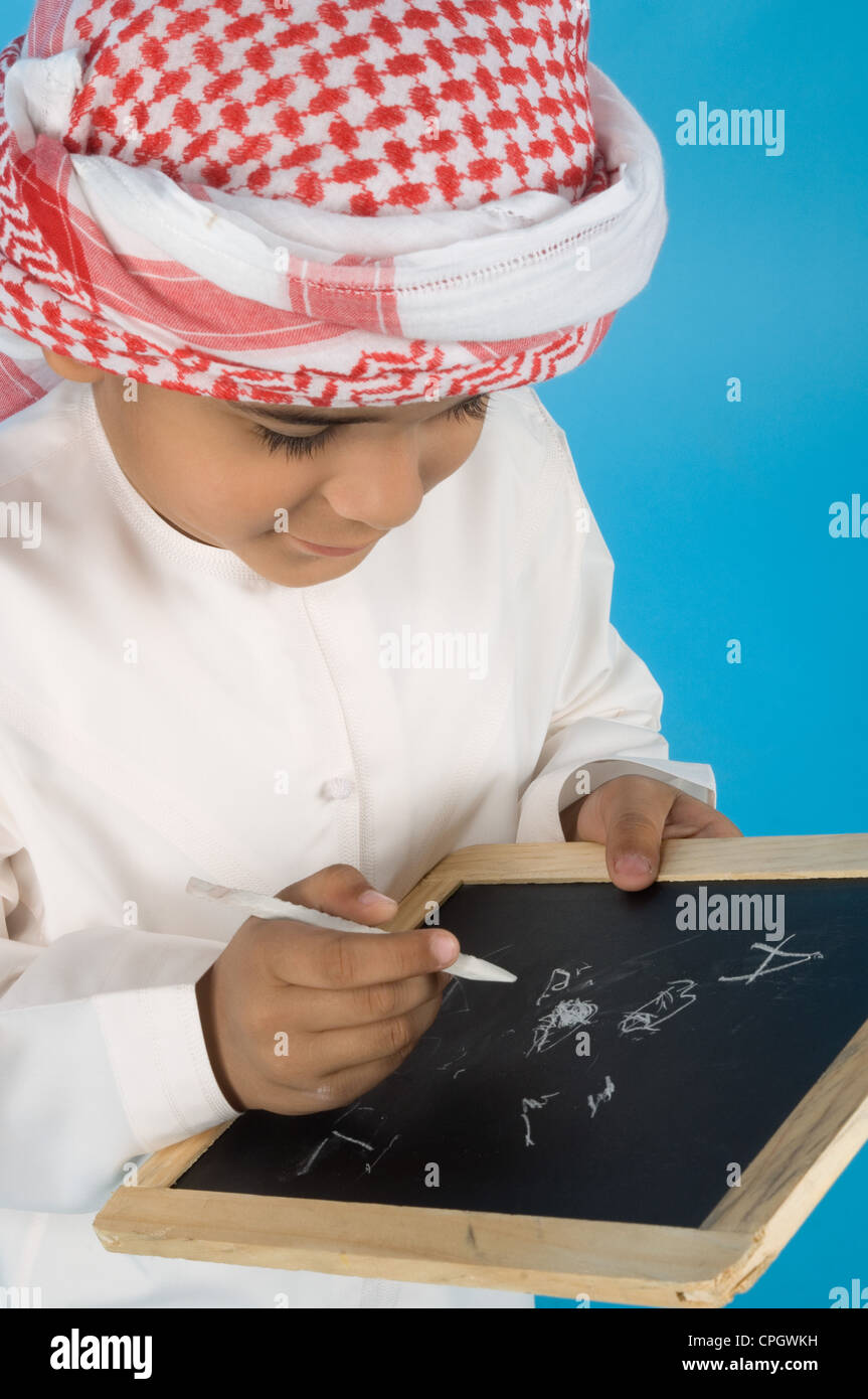 Emirati boy writing hi-res stock photography and images - Alamy