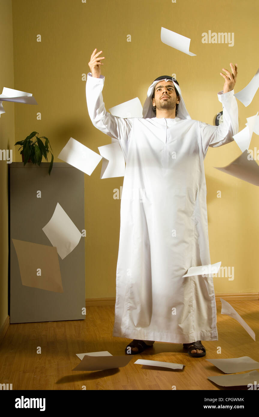 Arab man throwing papers Stock Photo - Alamy