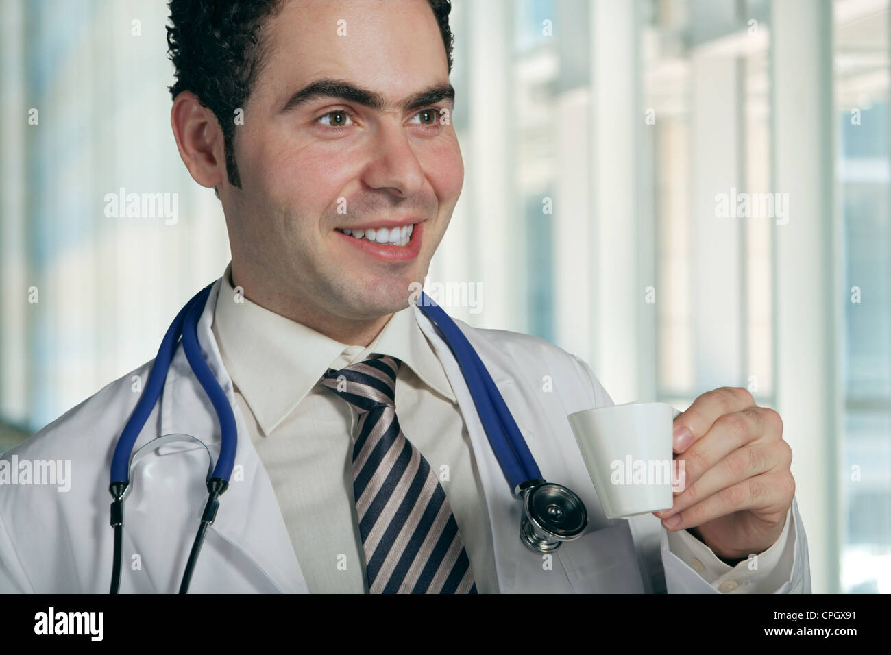 Doctor holding cup Stock Photo - Alamy
