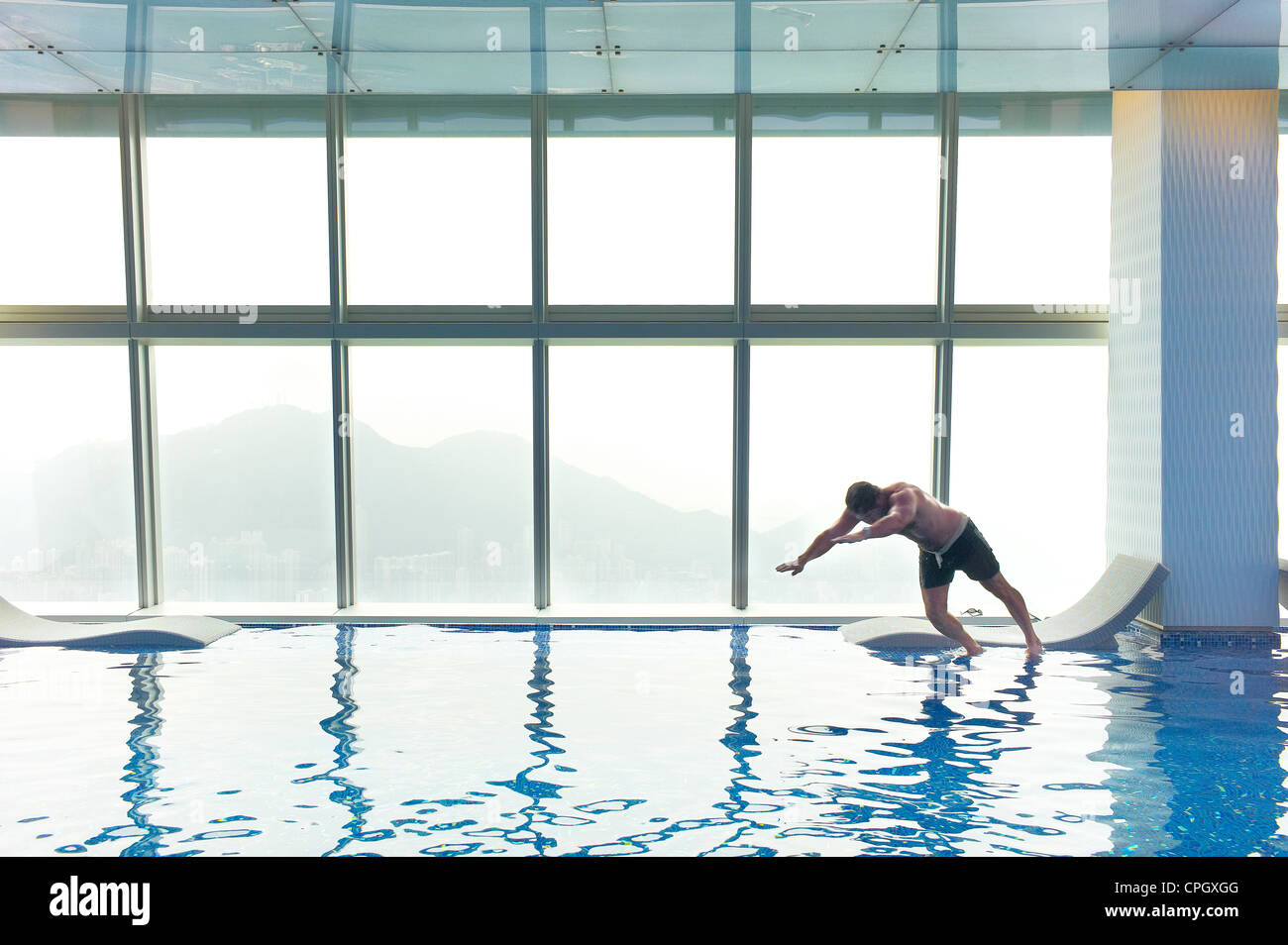 A man relaxes and swims at the world's highest swimming pool Stock ...