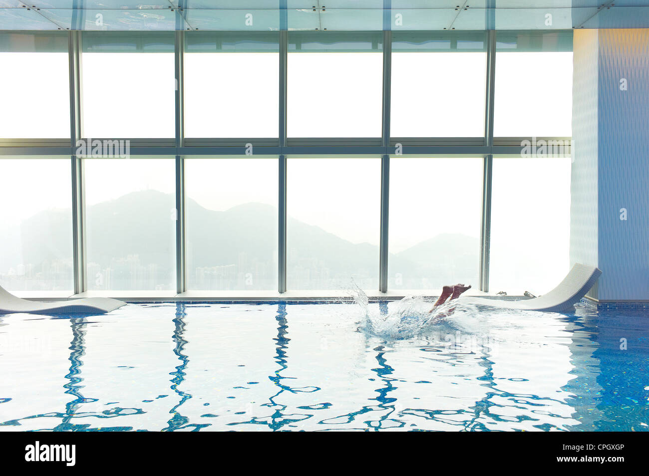 A man relaxes and swims at the world's highest swimming pool Stock ...
