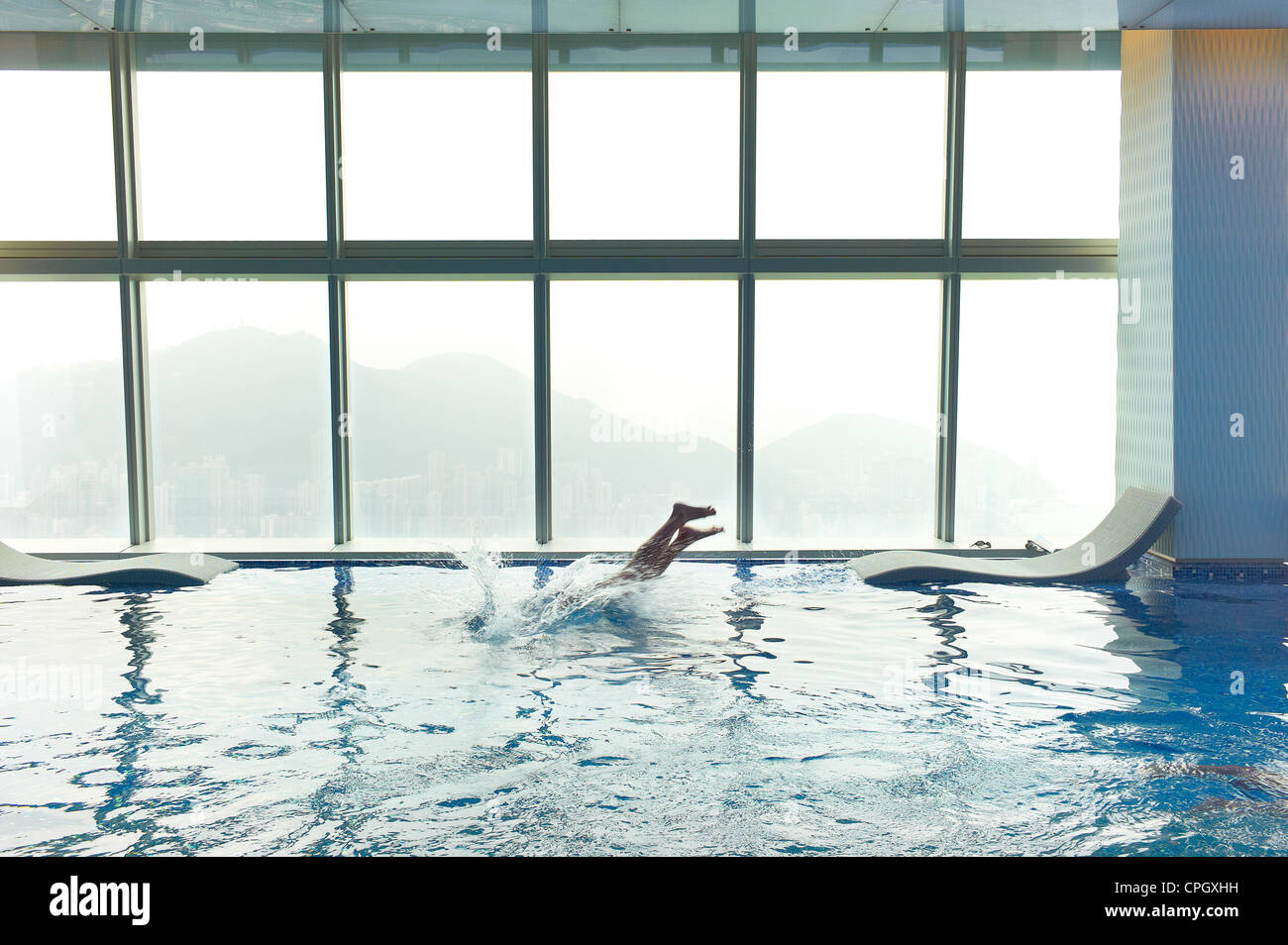 A man relaxes and swims at the world's highest swimming pool Stock ...