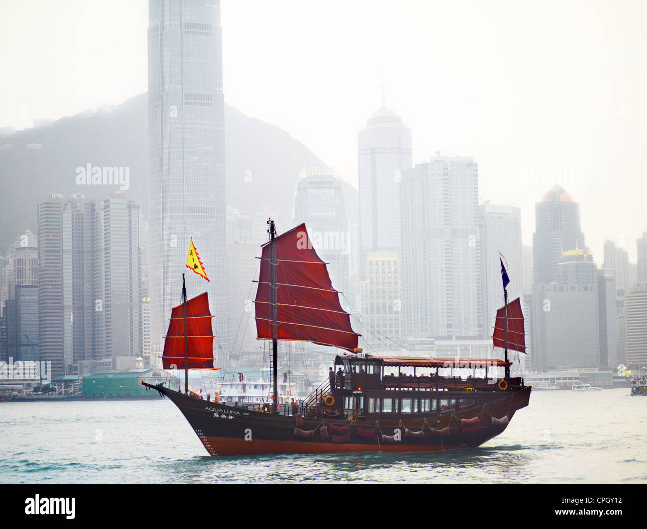 An old style Hong Kong Junk boat sails in Victoria Harbour in Hong Kong ...