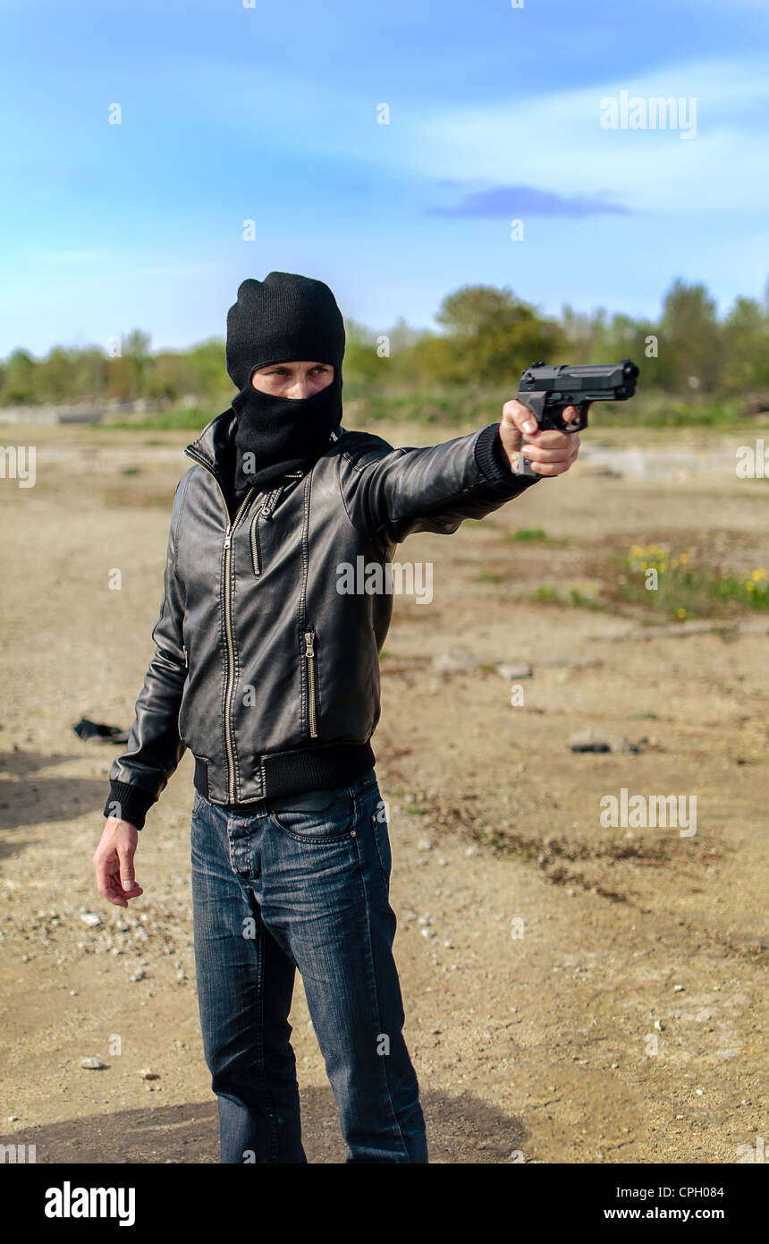 Masked gunman hi-res stock photography and images - Alamy