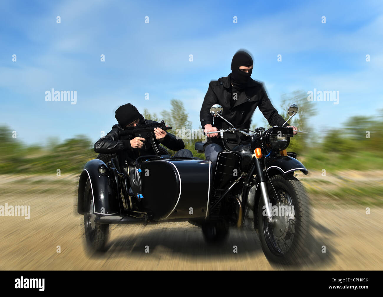 Two armed men riding a motorcycle with a sidecar. Motion blur Stock ...