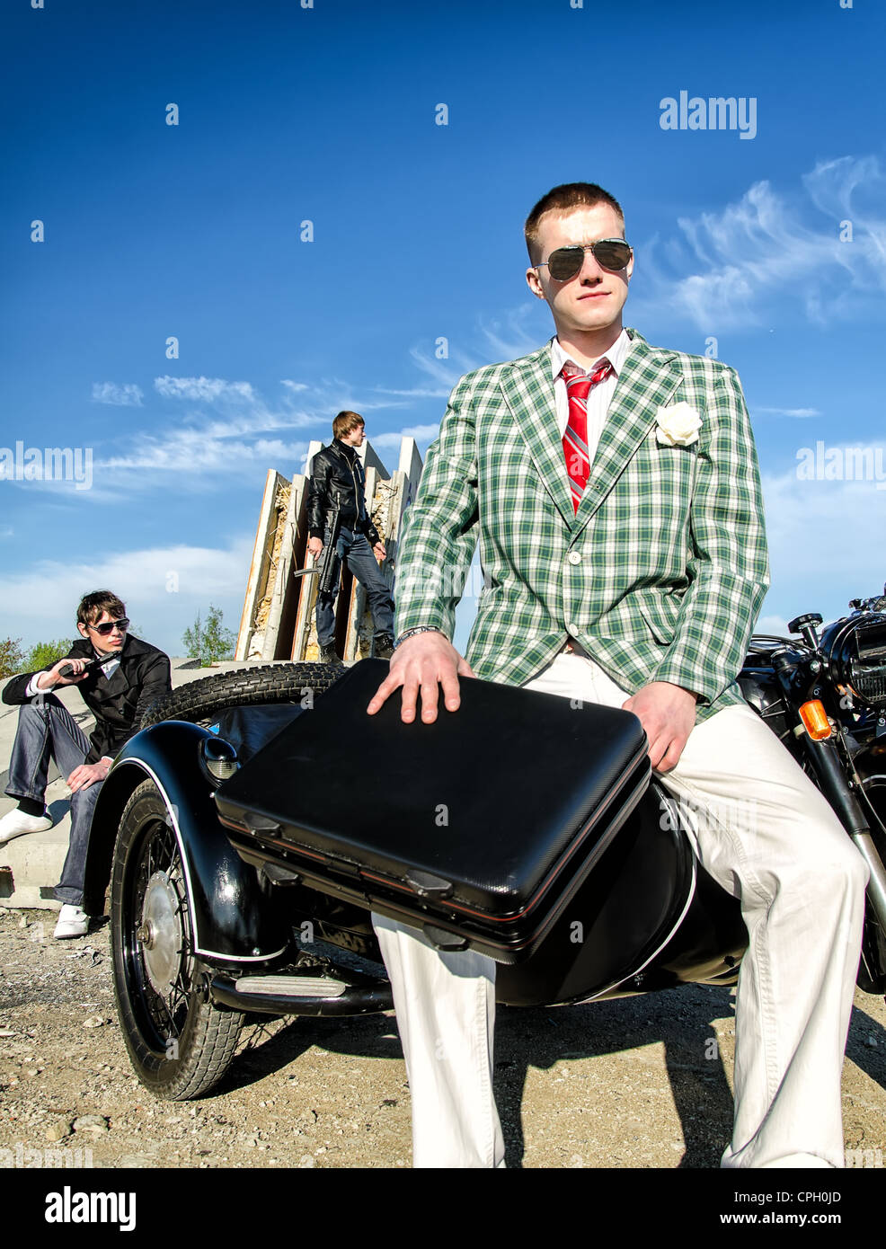 Mafia: Three thugs with a suitcase and weapons Stock Photo - Alamy