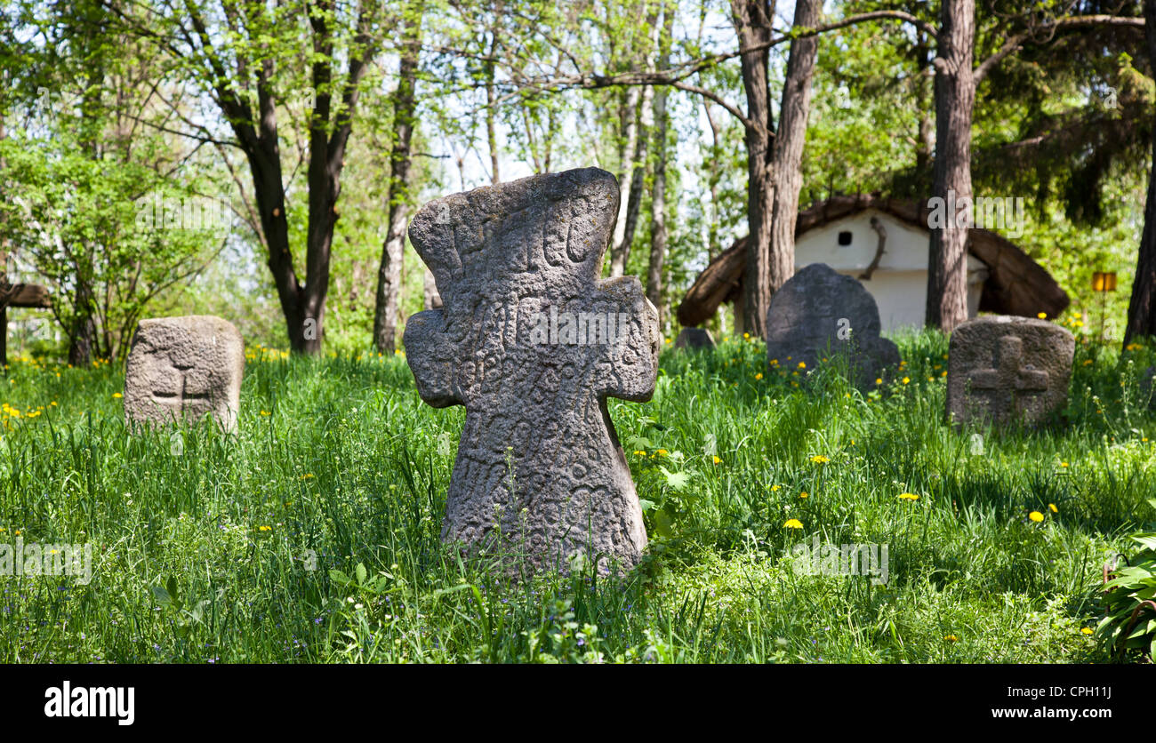 Ancient graves and hut in forest Stock Photo - Alamy