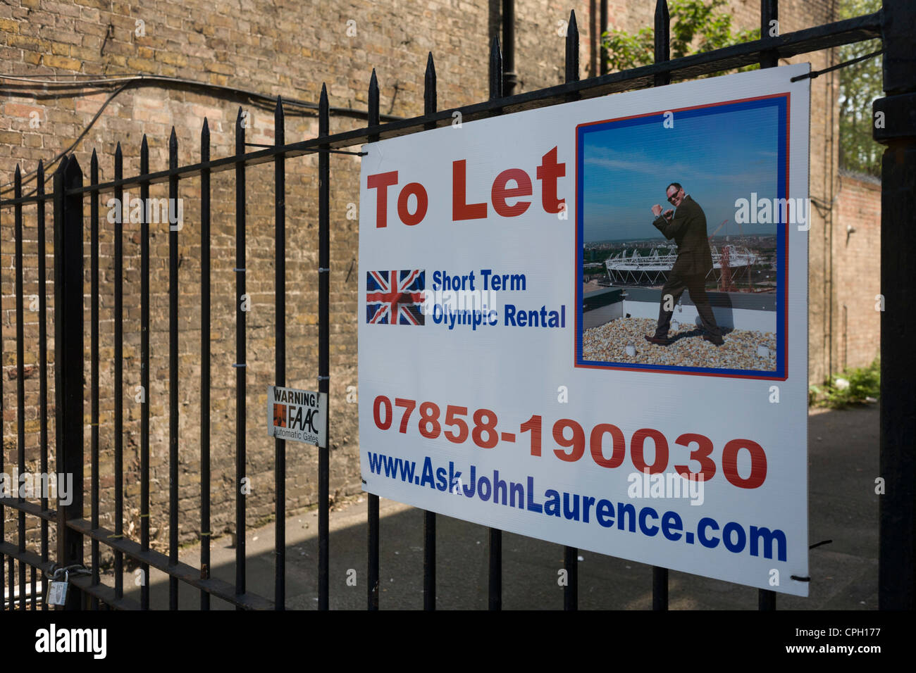 A To Let sign attached to the gate of a building offering space, near ...