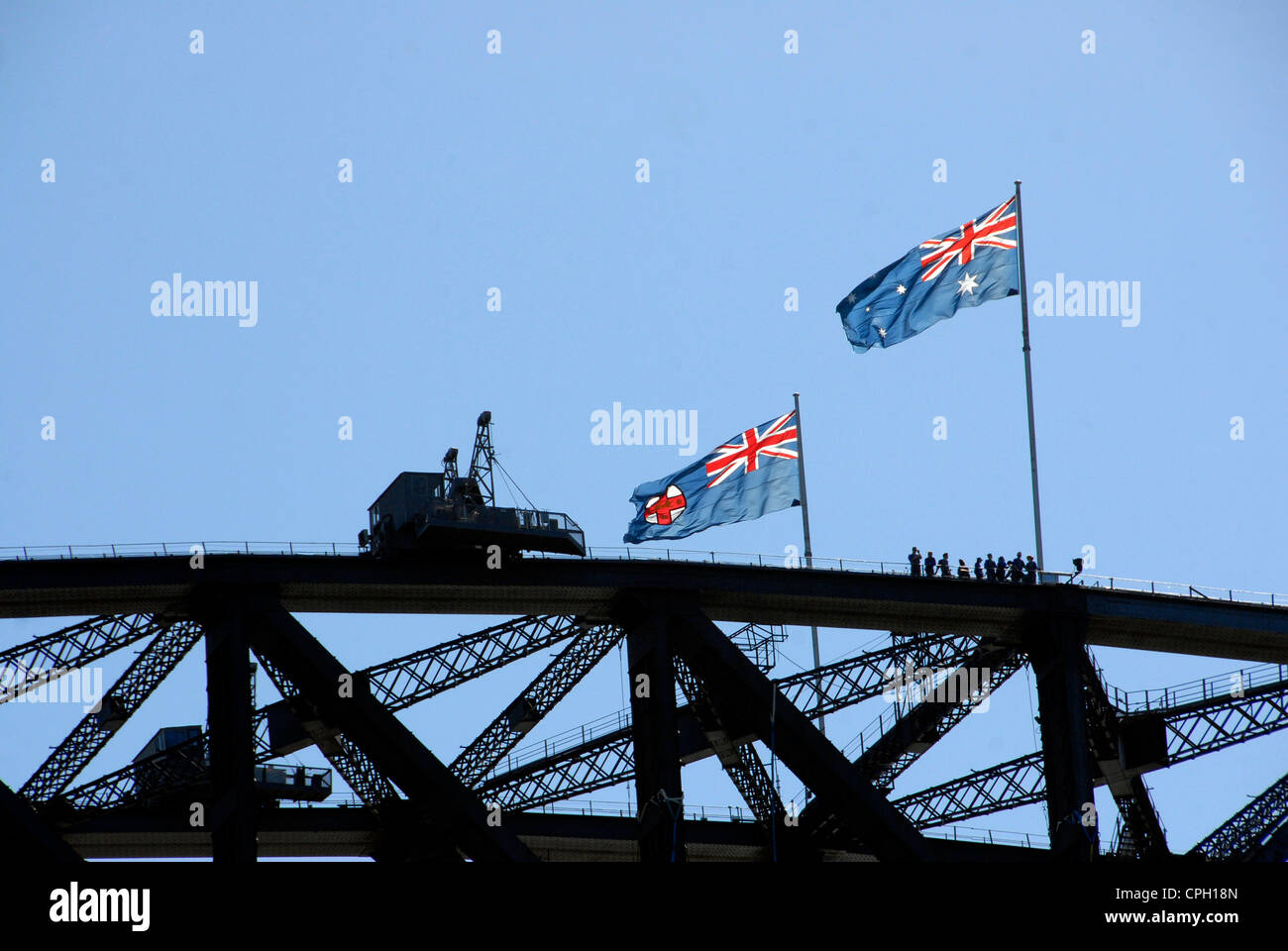 Tourists walking across the span of the Sydney Harbour Bridge Climb ...