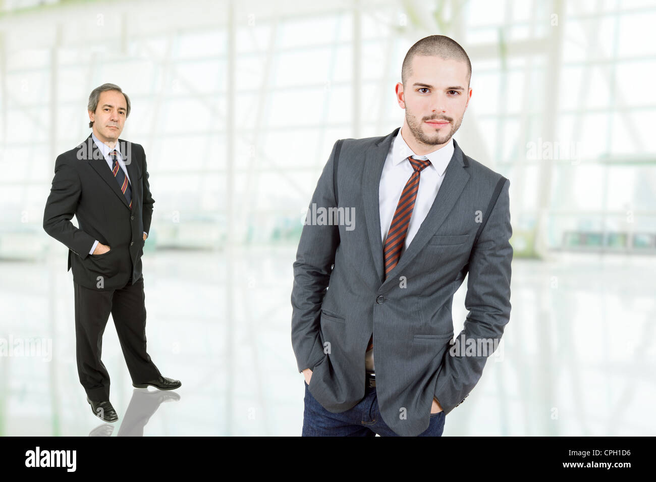 two business men standing at the office Stock Photo - Alamy