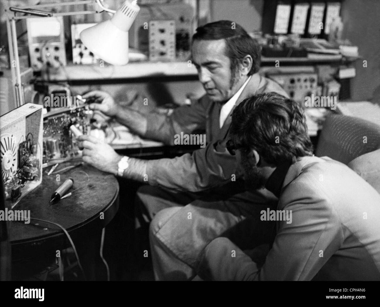 people, professions, electrician demonstrating his know-how for a ...