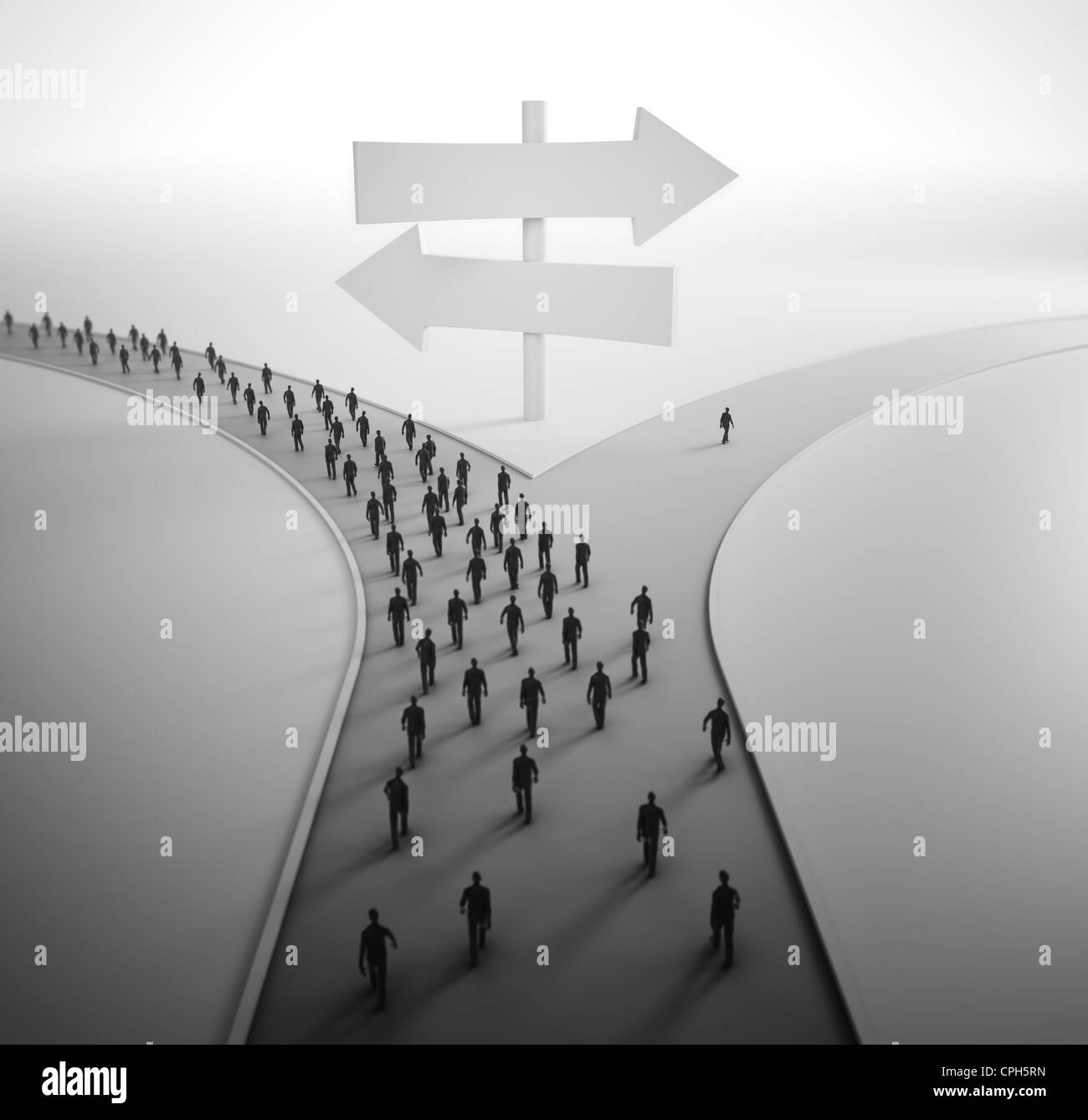 On the crossroads - tiny people choosing their pathway Stock Photo - Alamy